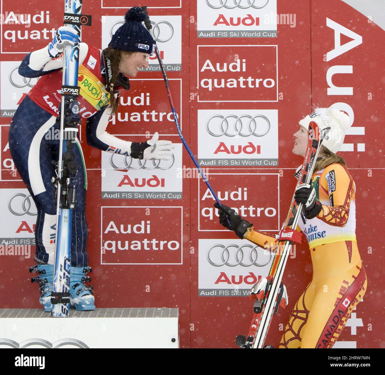 Canada's Kelly Vanderbeek, right, hands Nadia Franchini of Italy her ...