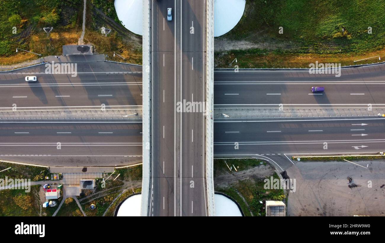 Cars go along the road asphalt bridge, junction. Top view Stock Photo ...
