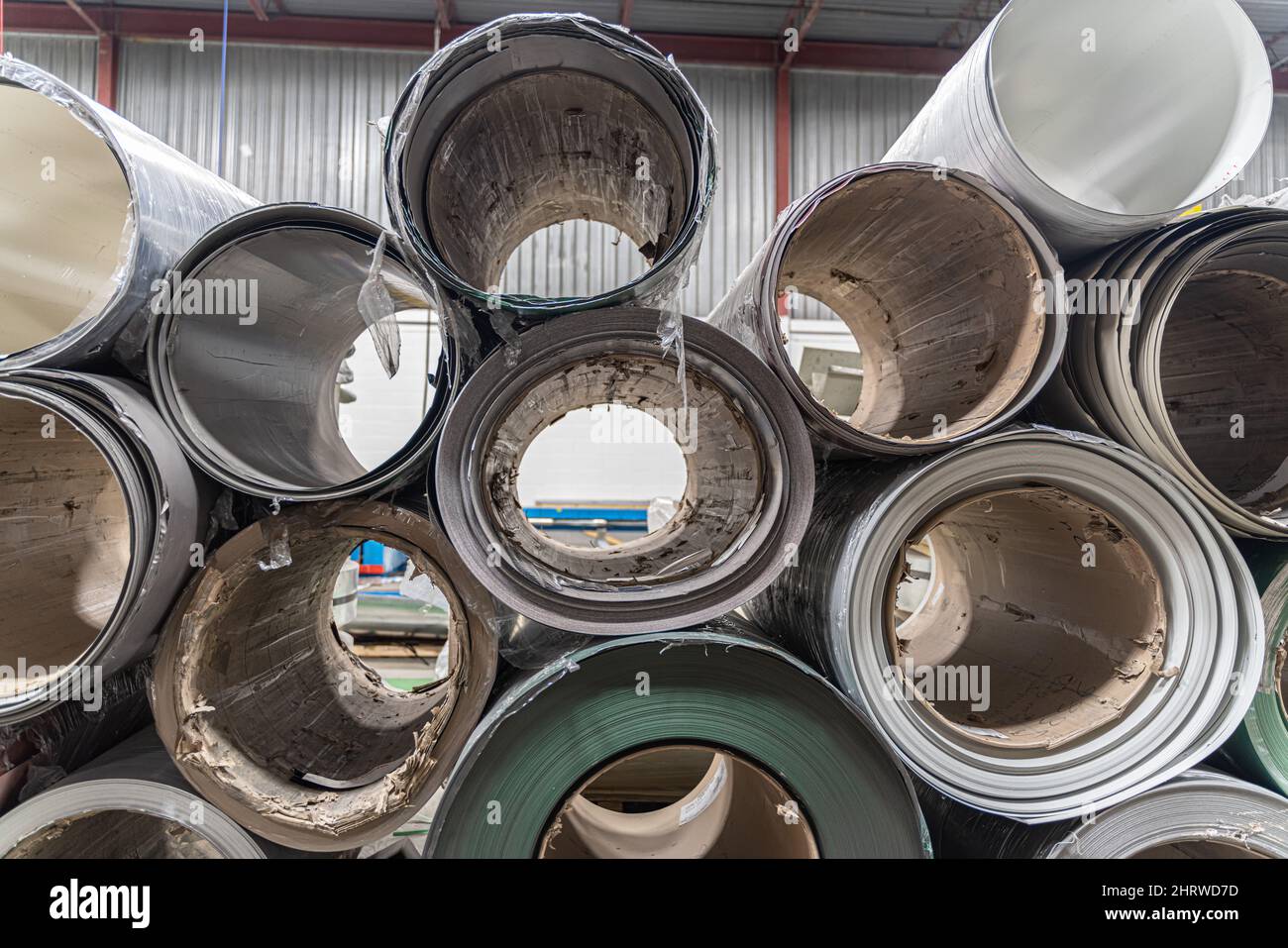 stack of Coil steel metal rolls in metal roofing factory Stock Photo ...