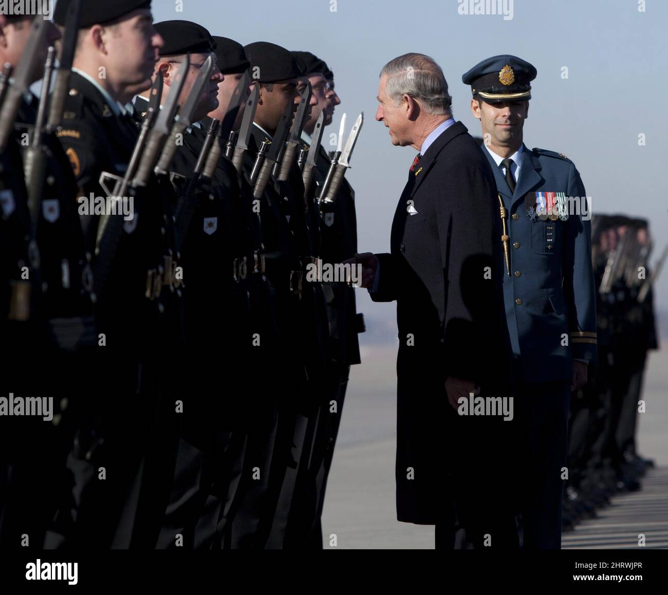 Prince Charles does an inspection during a departure ceremony at the ...