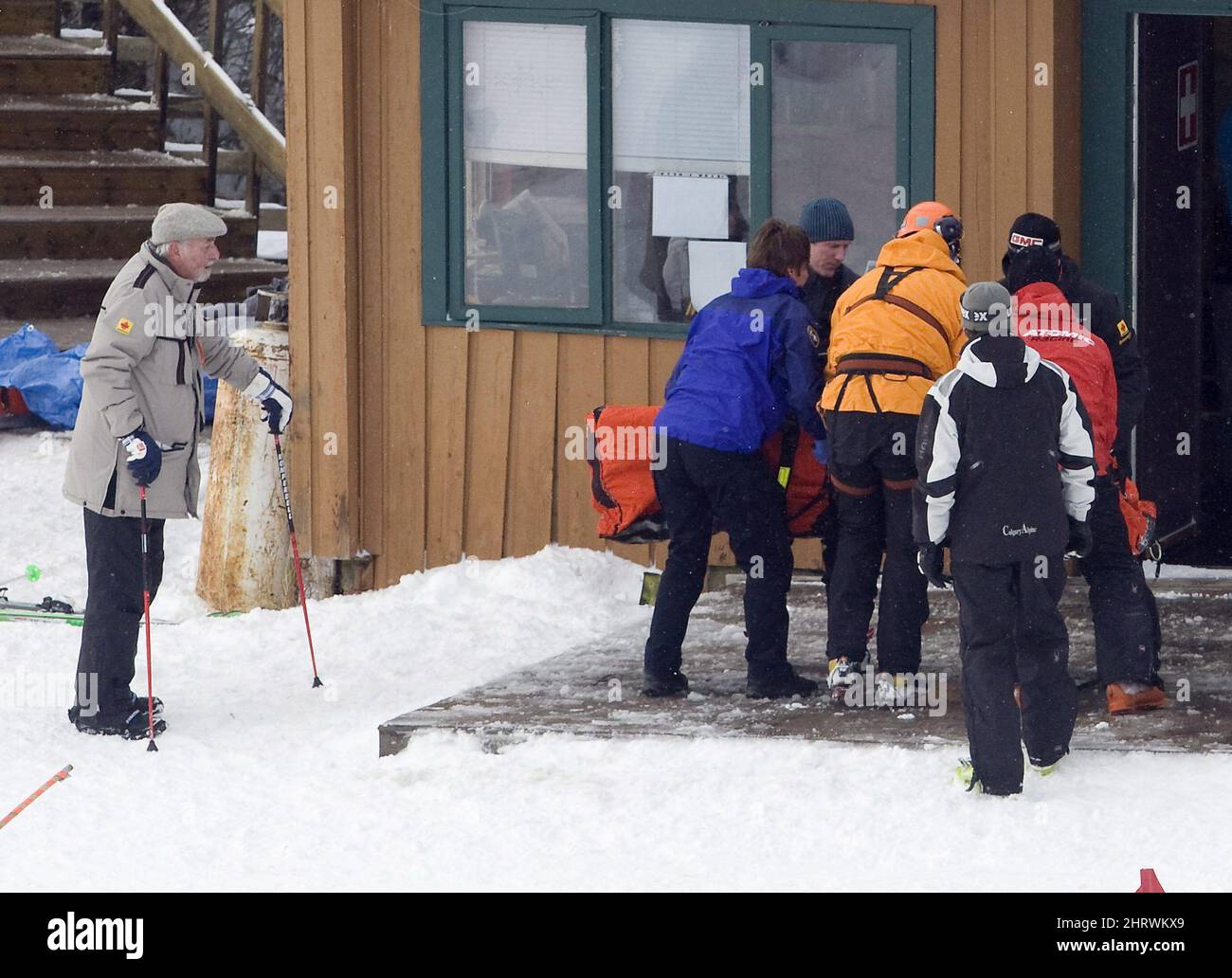 Jan Kucera (left) watches as his son John Kucera of Canada is carried ...