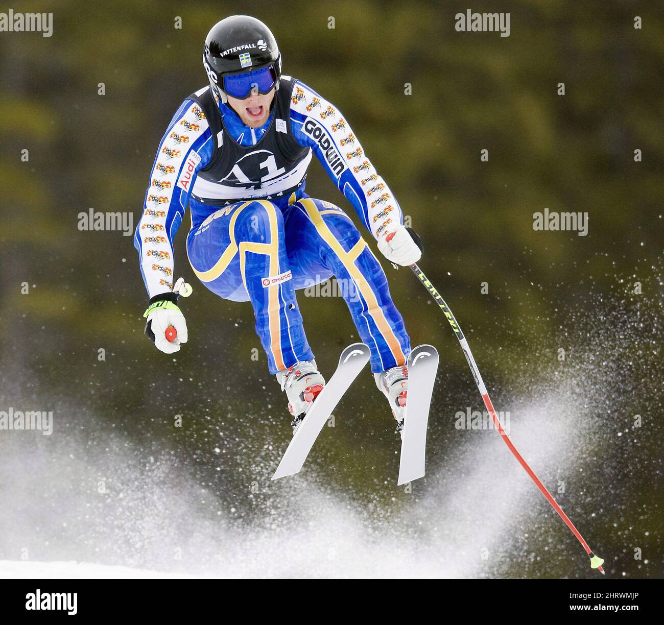 Hans Olsson, of Sweden, races down the course on the first training run ...