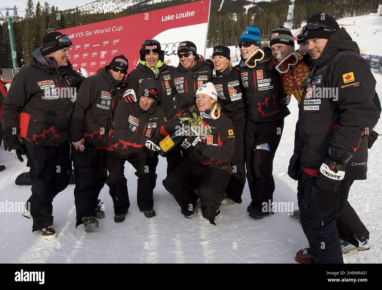 Canadian skier Emily Brydon, centre, celebrates her 3rd place finish ...