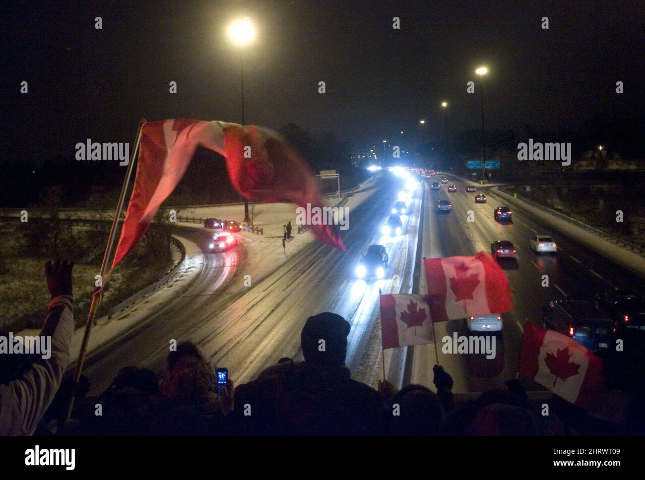 A procession of five hearses travels down the Don Valley Parkway in ...