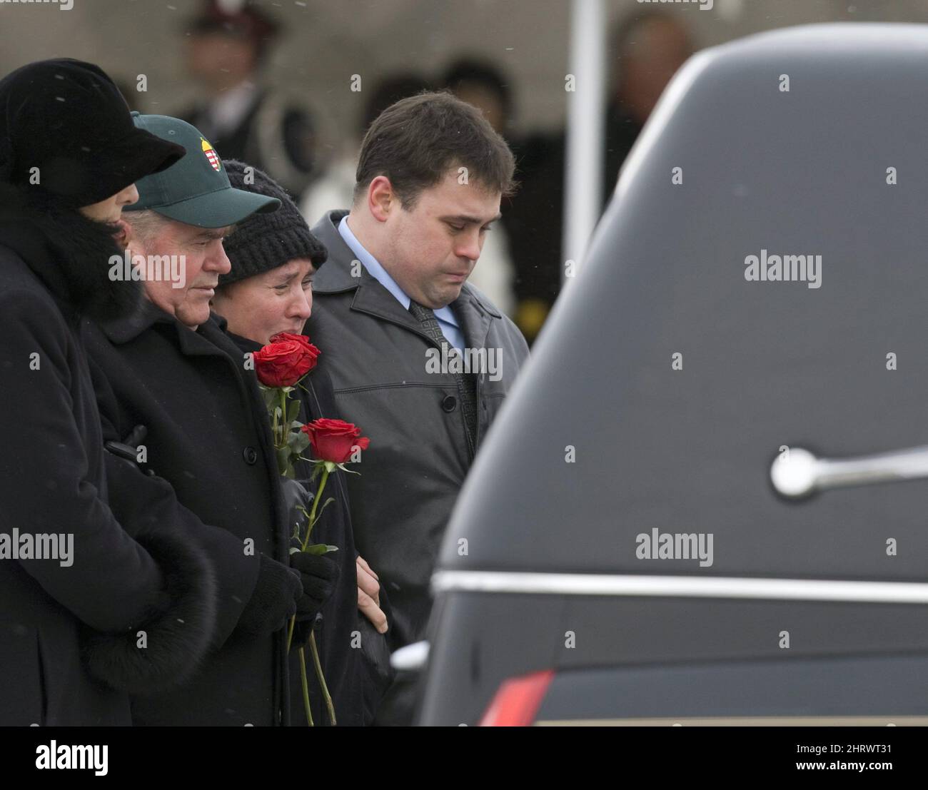 Family members of Sgt. George Miok of 41 Combat Engineer Regiment place ...