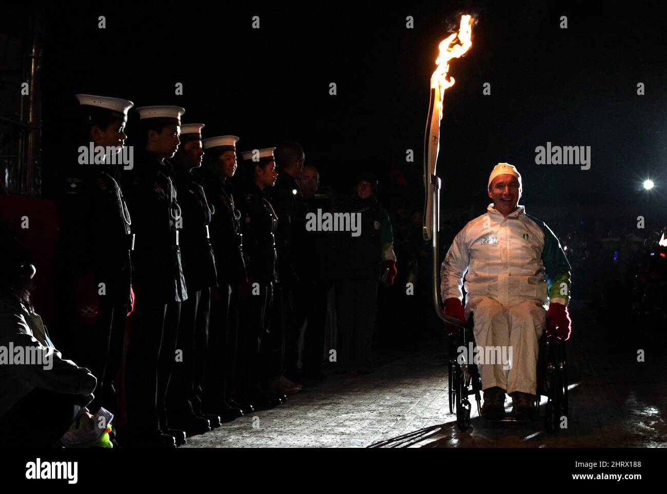 Six time Parlaympic medalist Rick Hansen, of Richmond, B.C., carries ...