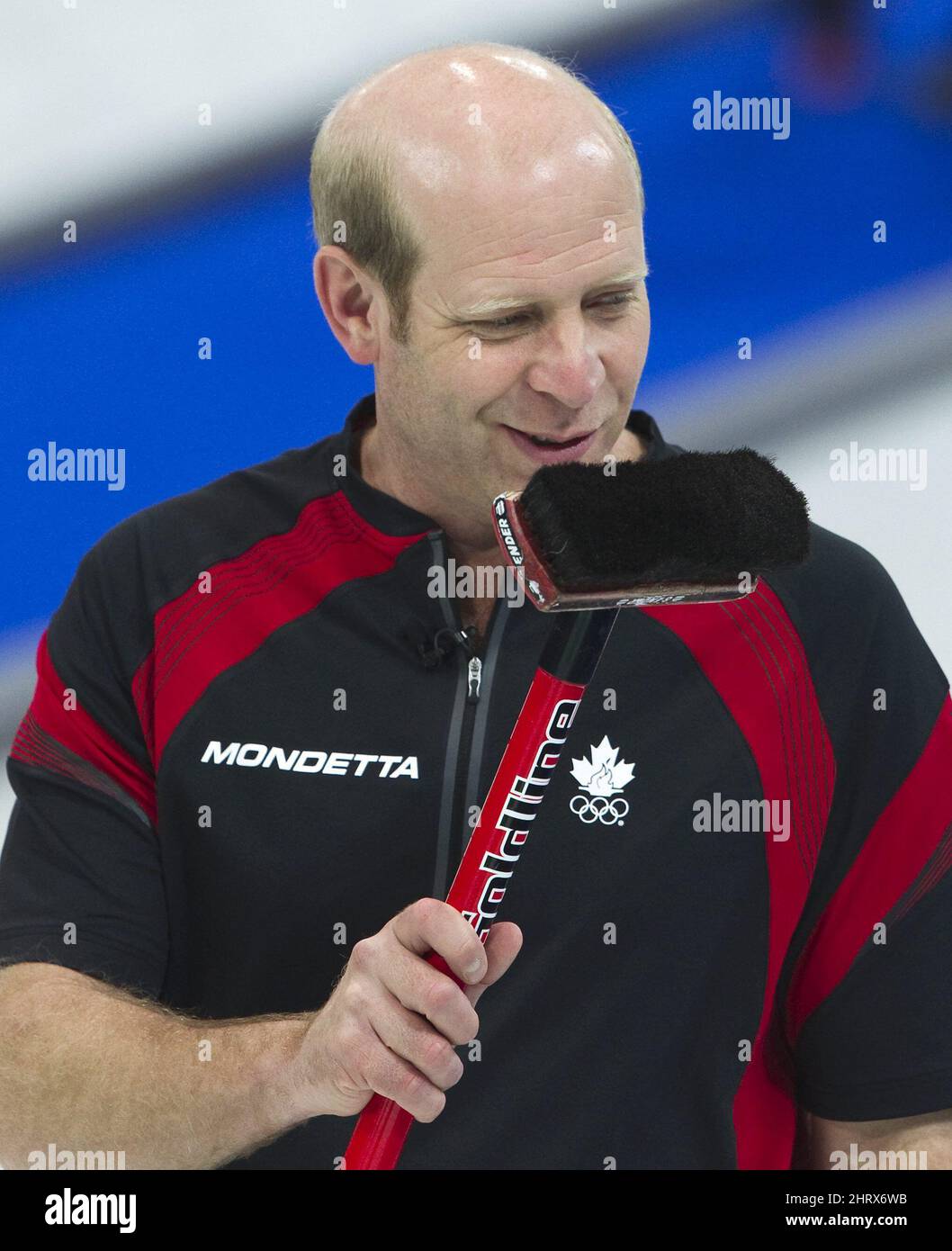 Team Canada skip Kevin Martin smiles while playing against Team Sweden ...