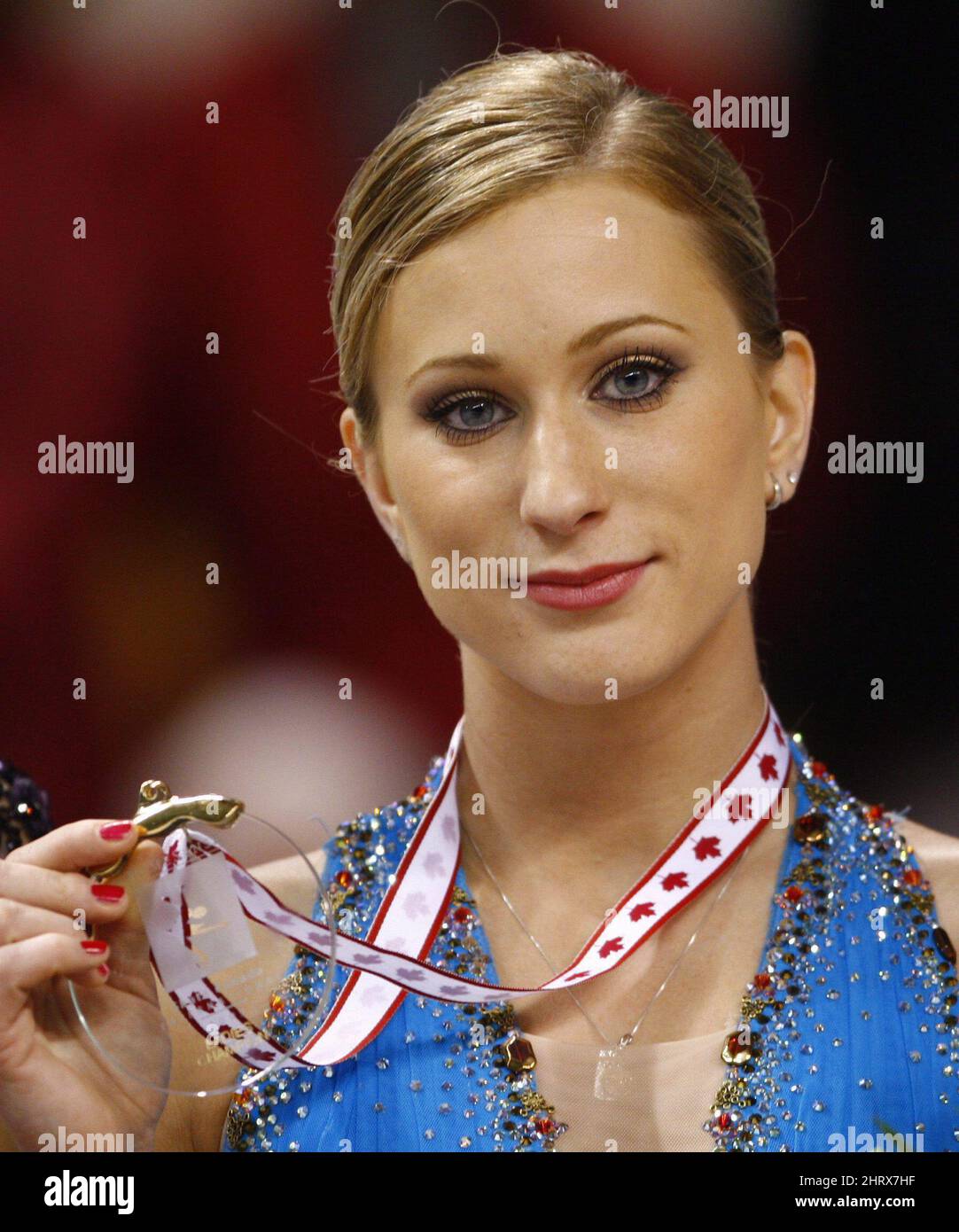 FILE--Canada's Joannie Rochette from Ile Dupas, Que. holds up her gold ...