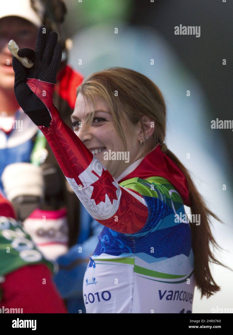 Canada's Michelle Kelly waves to the crowd following her skeleton run ...