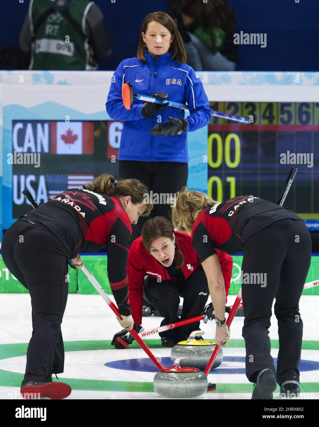 Team Canada skip Cheryl Bernard, bottom centre, calls as third Susan O ...