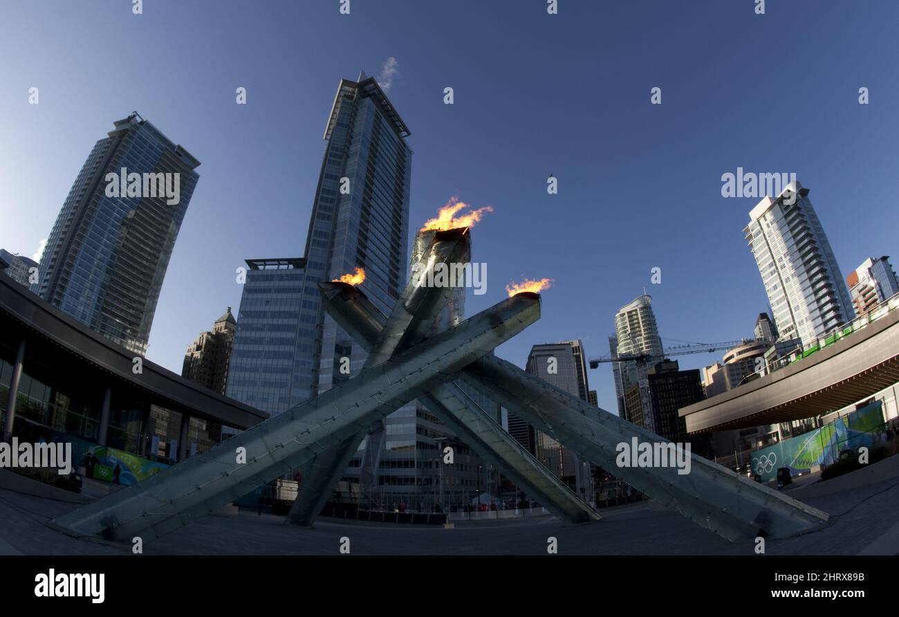 The Olympic cauldron burns at the 2010 Vancouver Winter Olympics Monday ...