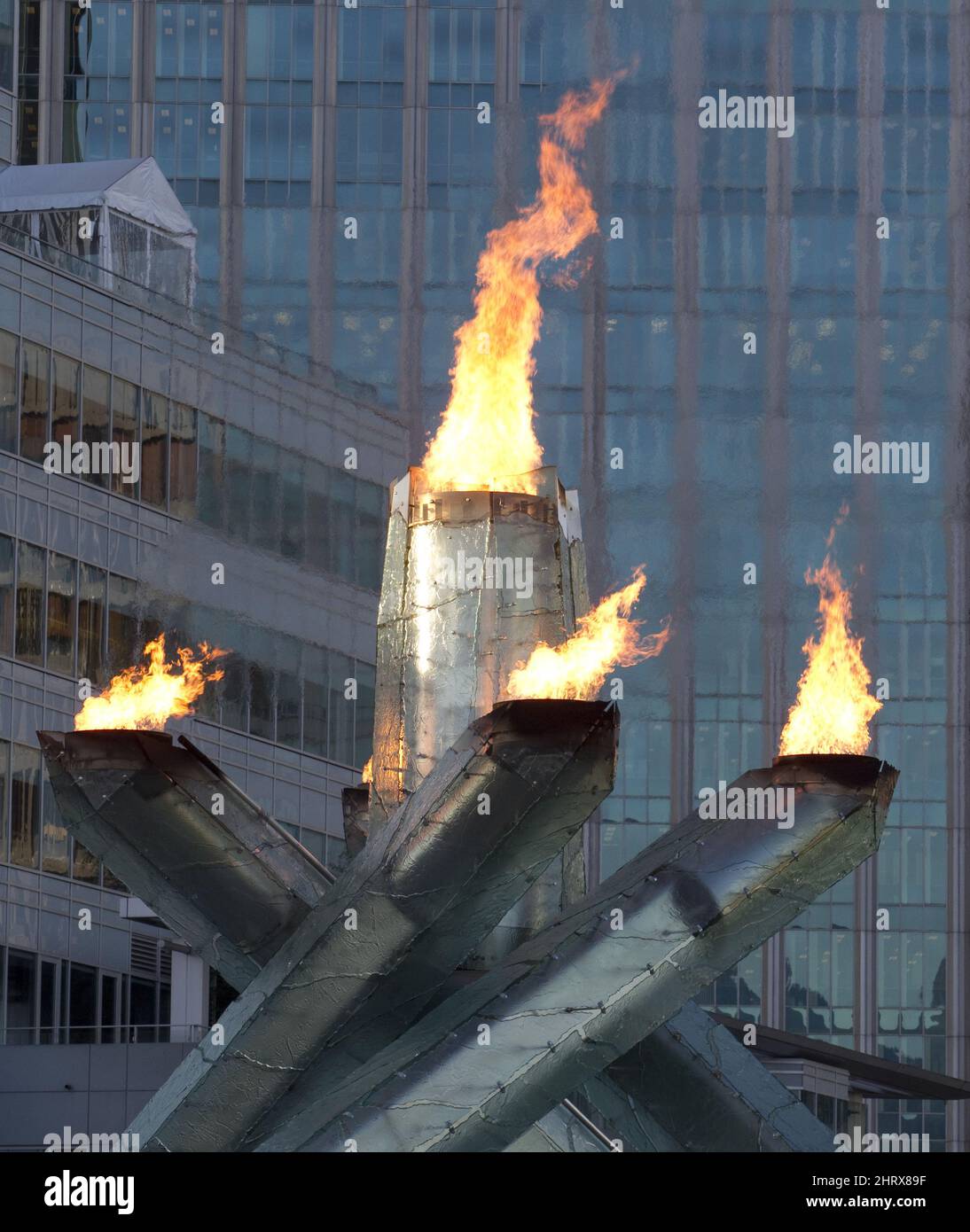 The Olympic cauldron burns at the 2010 Vancouver Winter Olympics Monday ...