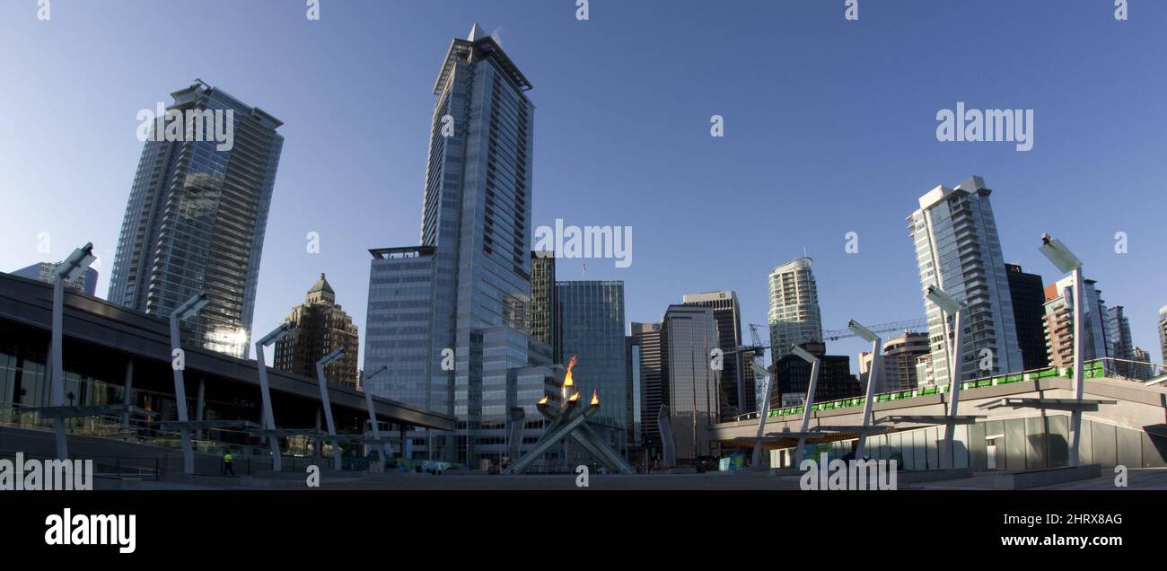 The vancouver skyline is seen behind the Olympic cauldron at the 2010 ...