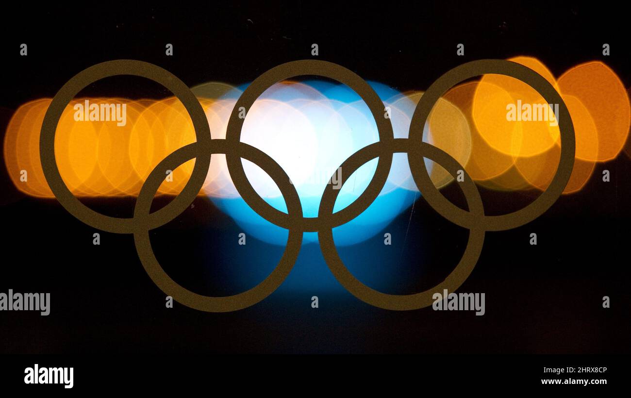 The Olympic rings are illuminated by city lights at the 2010 Winter ...