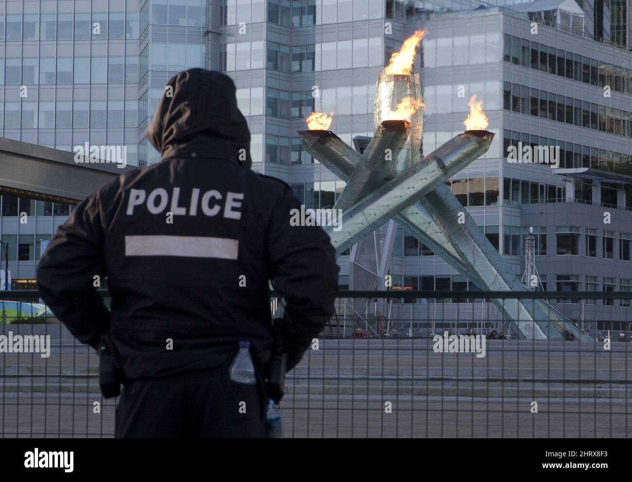 A police officer surveys the site of the Olympic cauldron at the 2010 ...