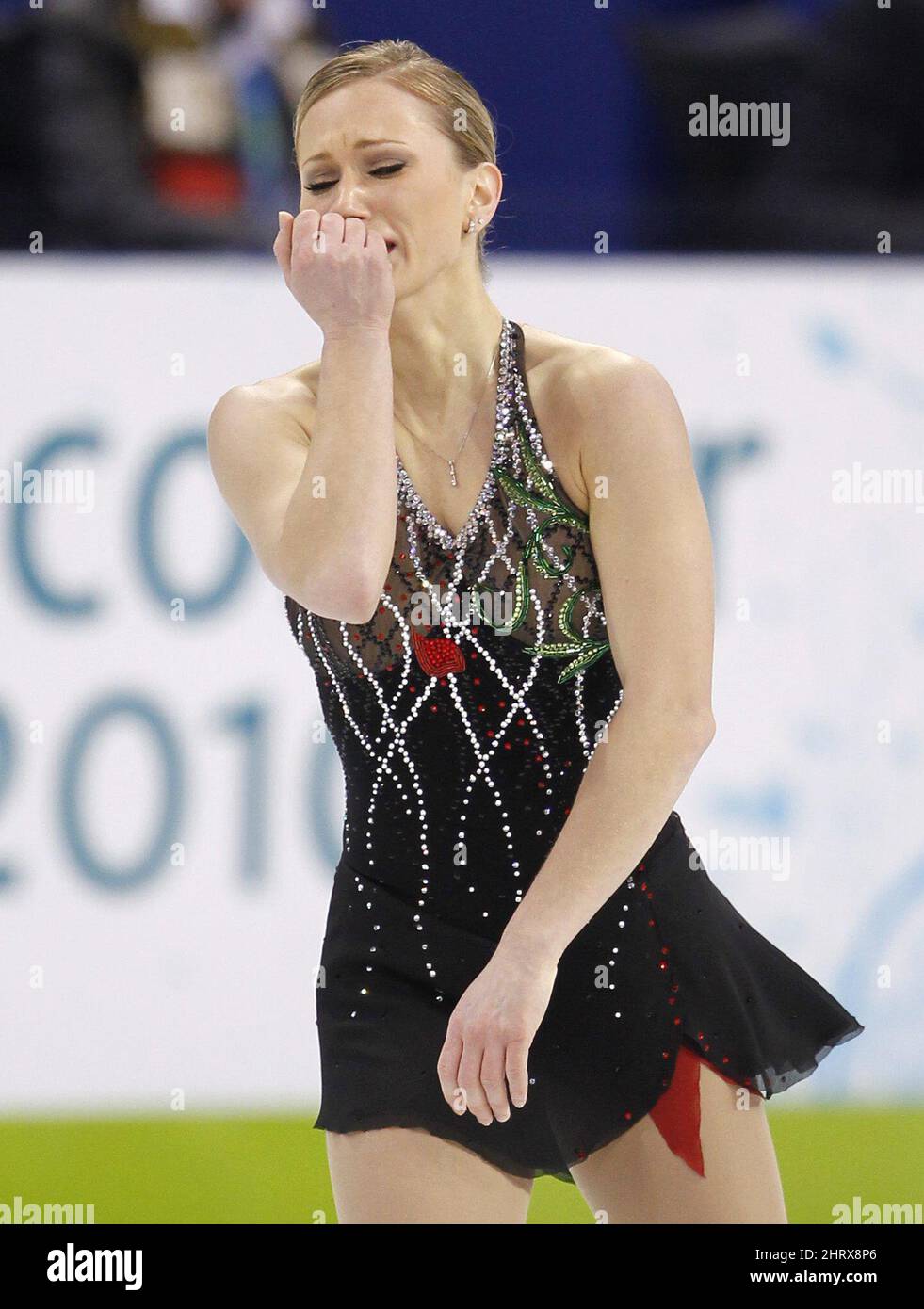 Canada's Joannie Rochette fights back tears following her short program ...