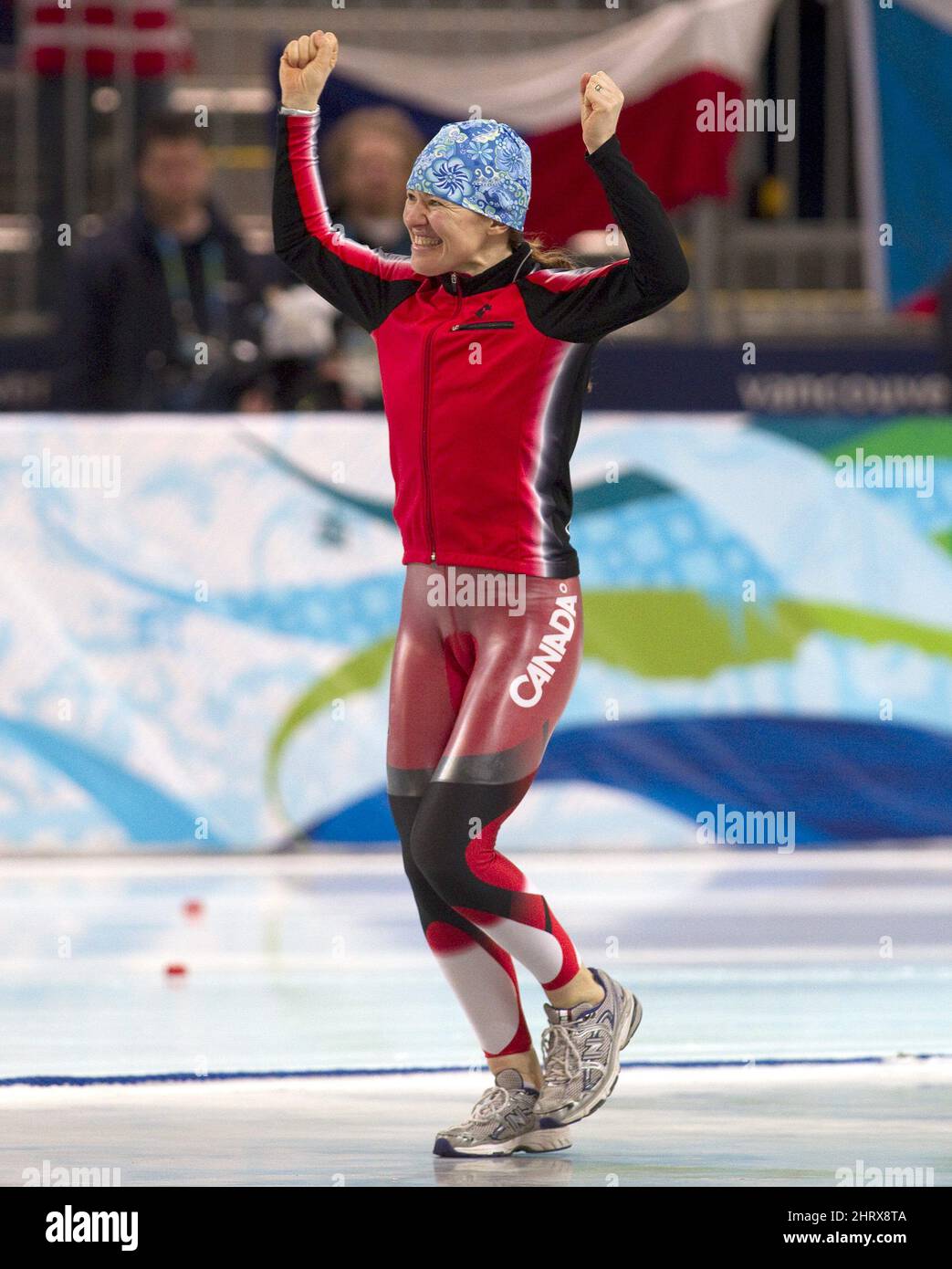 Canadian speedskater Clara Hughes runs a victory lap after winning the ...