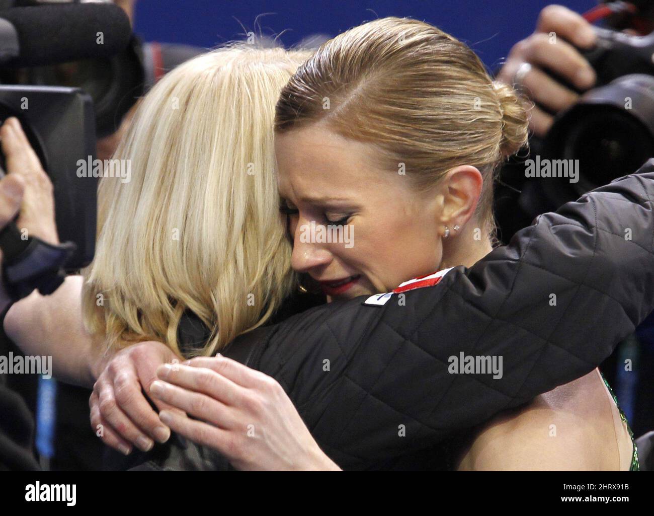 Canada's Joannie Rochette hugs her coach Manon Perron following her ...