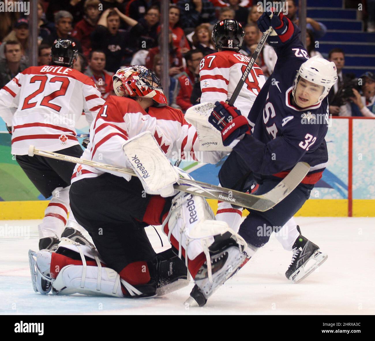 USA's Dustin Brown drives to Canada's Roberto Luongo's net during first ...