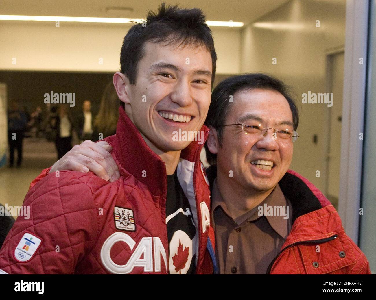 Figure skater Patrick Chan (left) embraces his father Lewis after ...