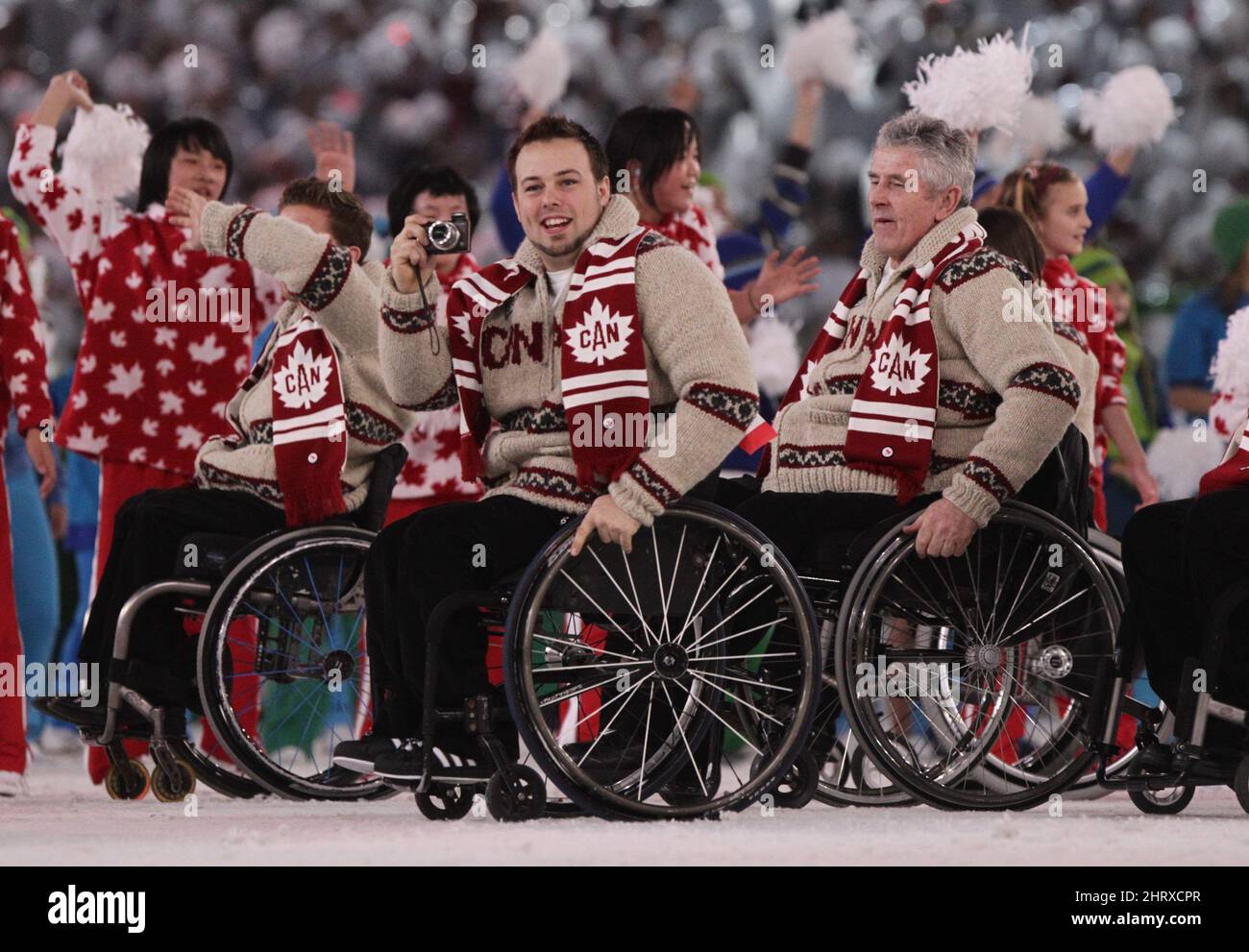 Members of team Canada arrive during the opening ceremonies of the ...