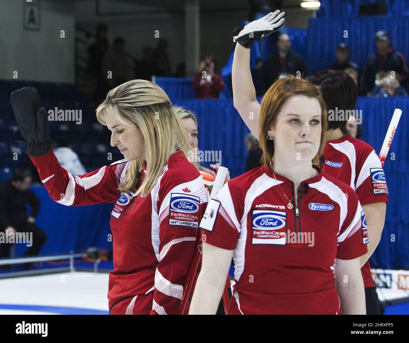 Canada skip Jennifer Jones, left, waves to the crowd along with ...