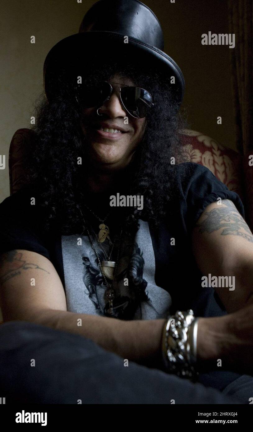 Guitarist Slash poses for a photo in a Toronto hotel room on Friday ...