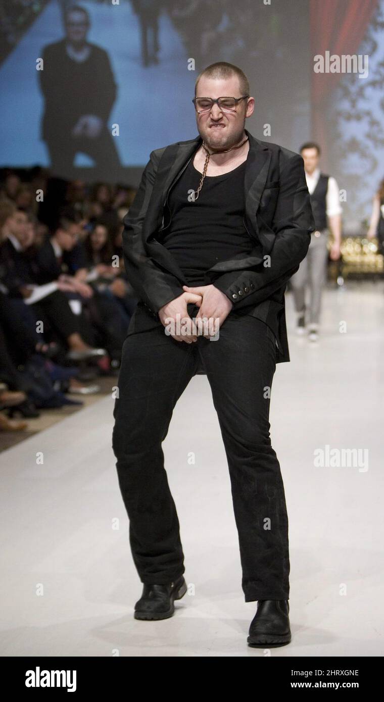 Designer Evan Biddell gestures on the runway during the Bustle show at ...