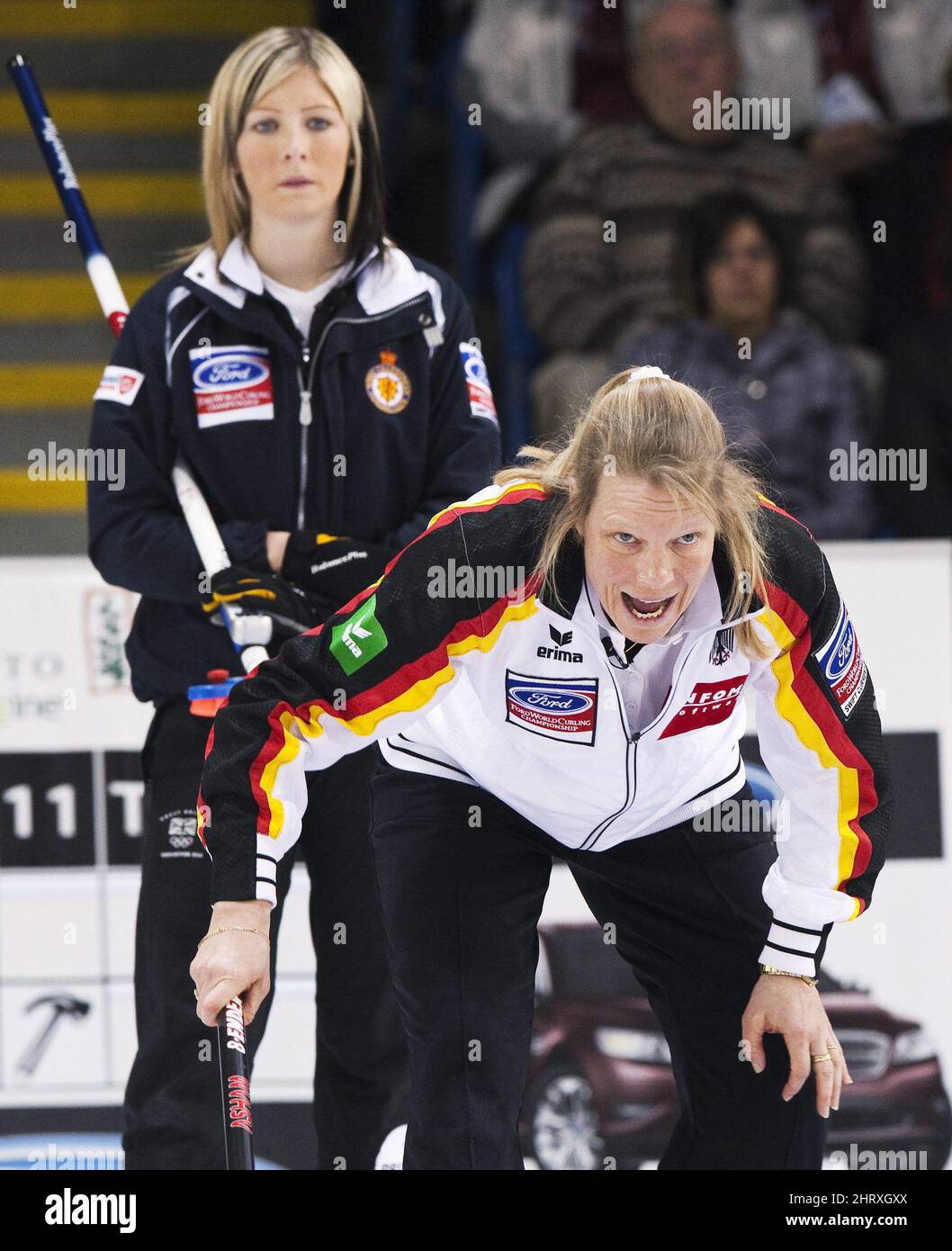 Scotland skip Eve Muirhead, left, looks up ice as Germany skip Andrea ...