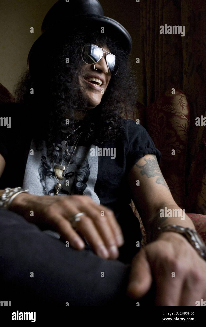 Guitarist Slash poses for a photo in a Toronto hotel room on Friday ...