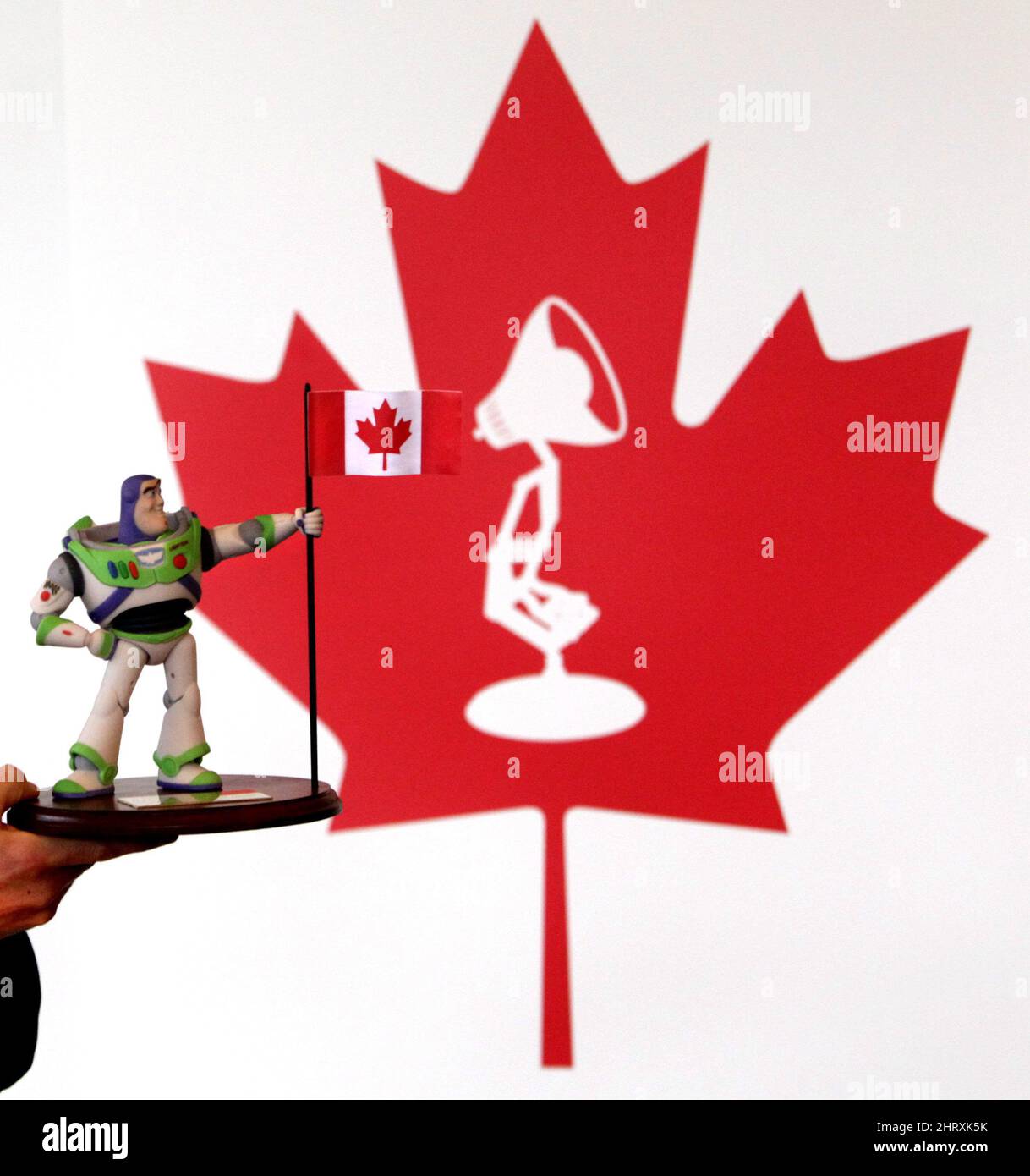 Vancouver Mayor Gregor Robertson holds a figure of Buzz Lightyear, from ...