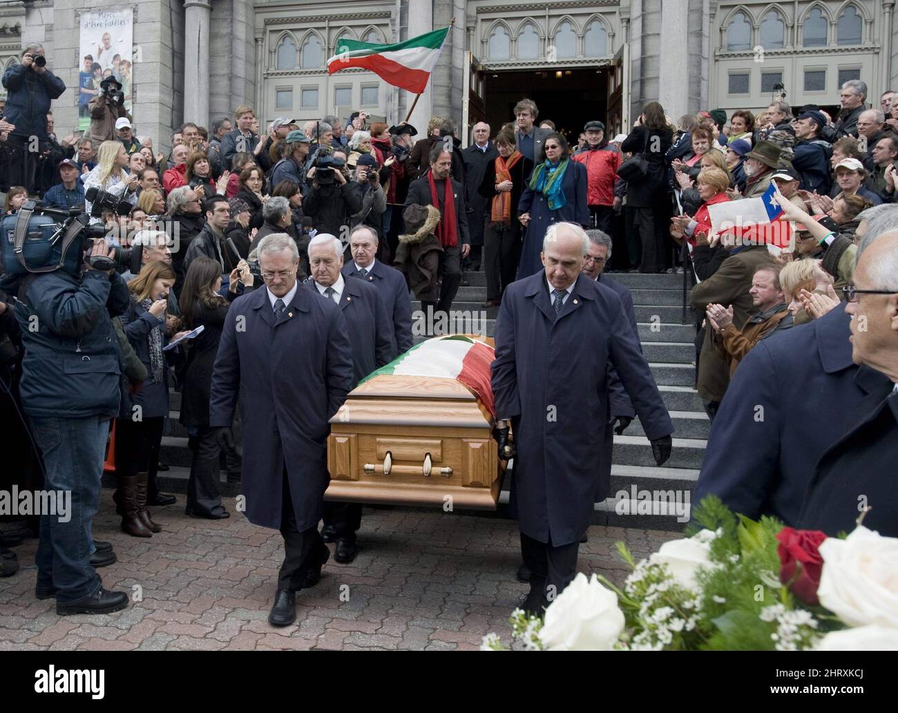 Family members walk behind the coffin of union leader Michel Chartrand ...