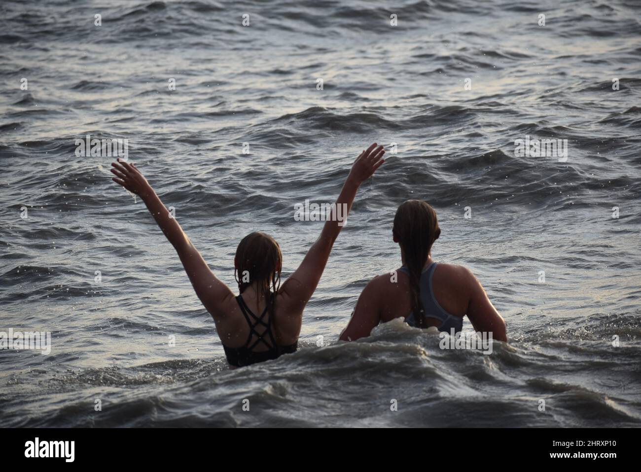 Friends having fun and swimming in the sea Stock Photo - Alamy