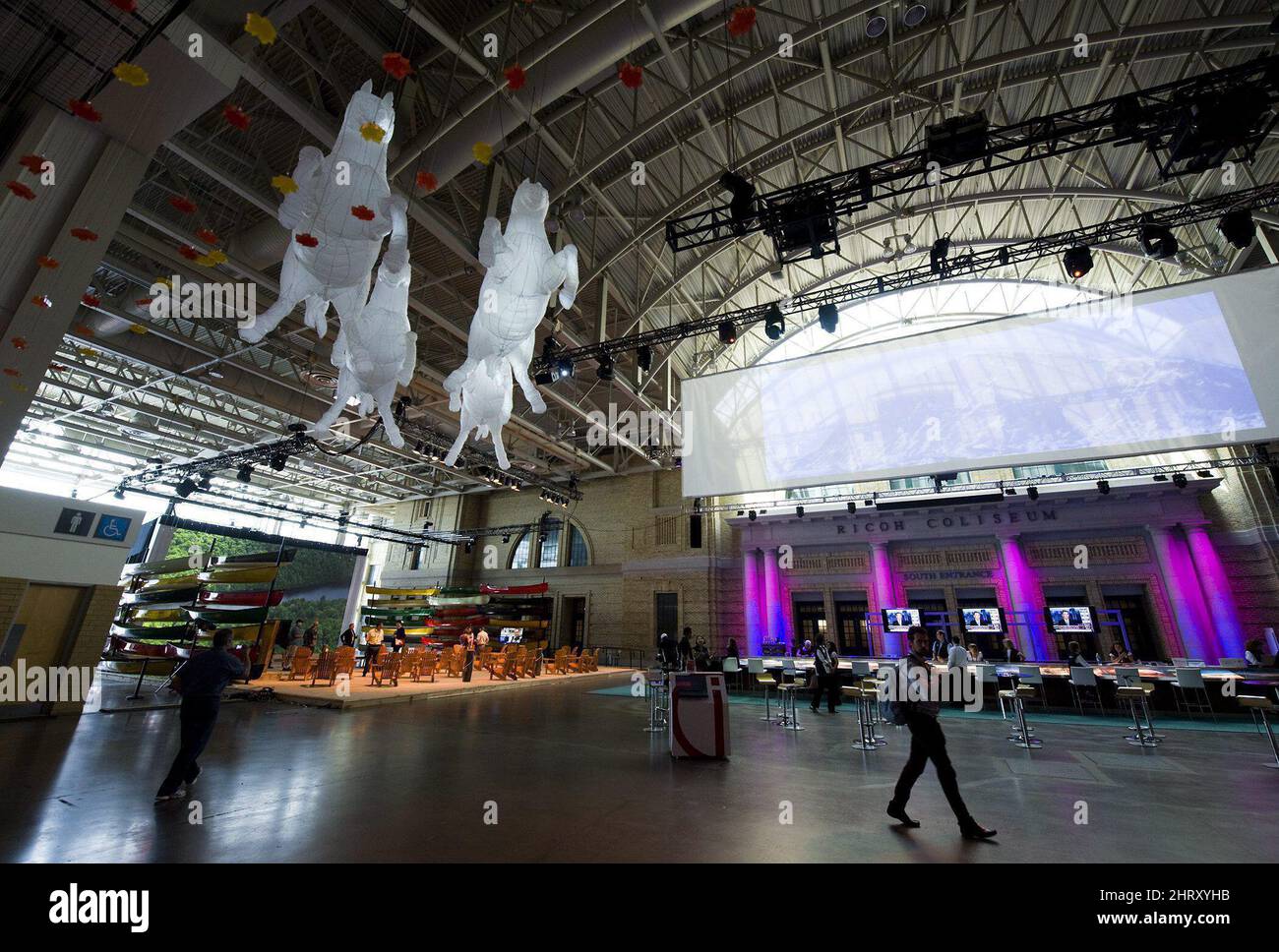 People walk past the fake lake at the G20 media centre in Toronto, on ...
