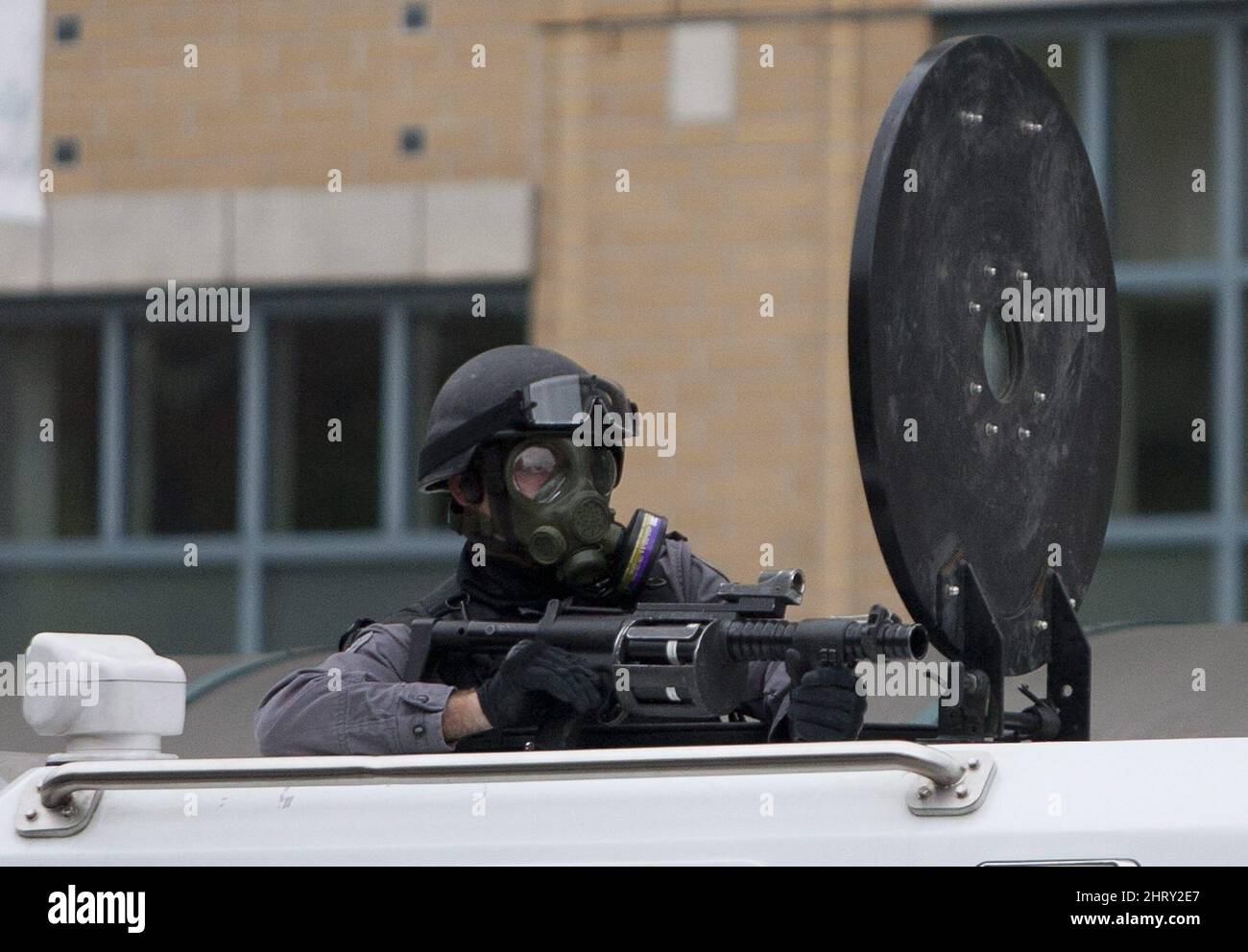 A member of the Emergency Task Force sitting in an armoured vehicle ...