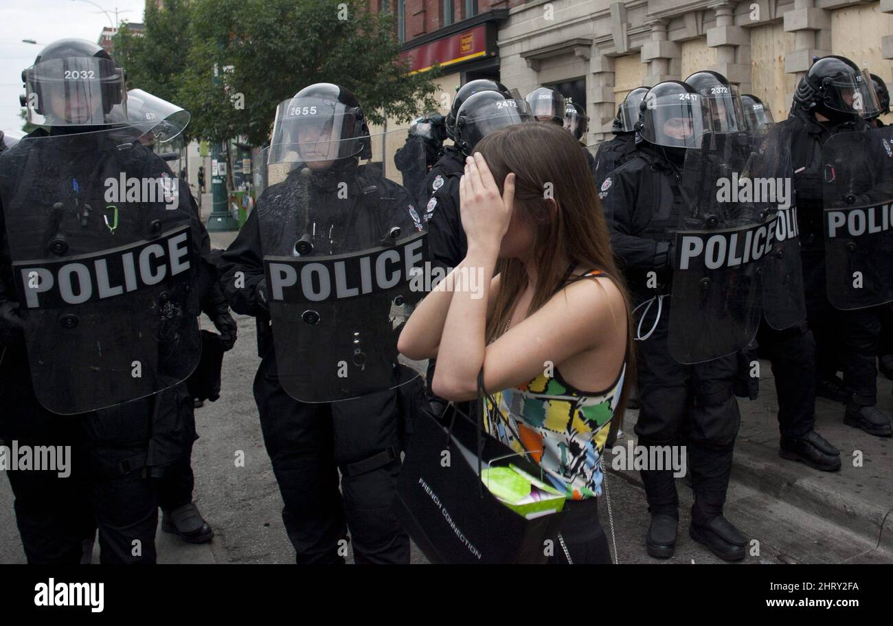 A Woman Reacts As Rcmp Officers Dressed In Riot Gear Encircle And Detain Hundreds Of People In 0616