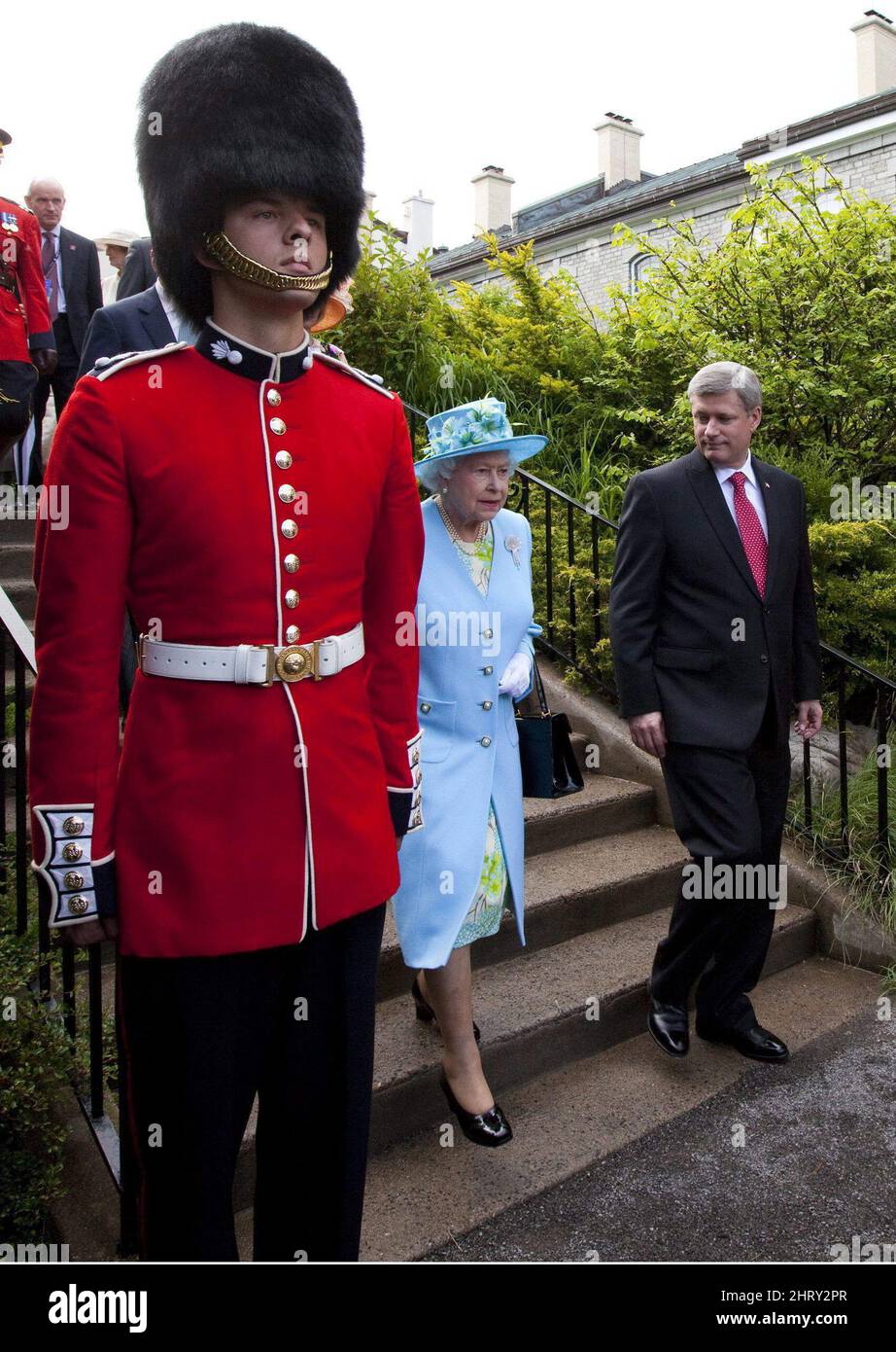 Queen Elizabeth II is accompanied by Prime Minister Stephen Harper as ...