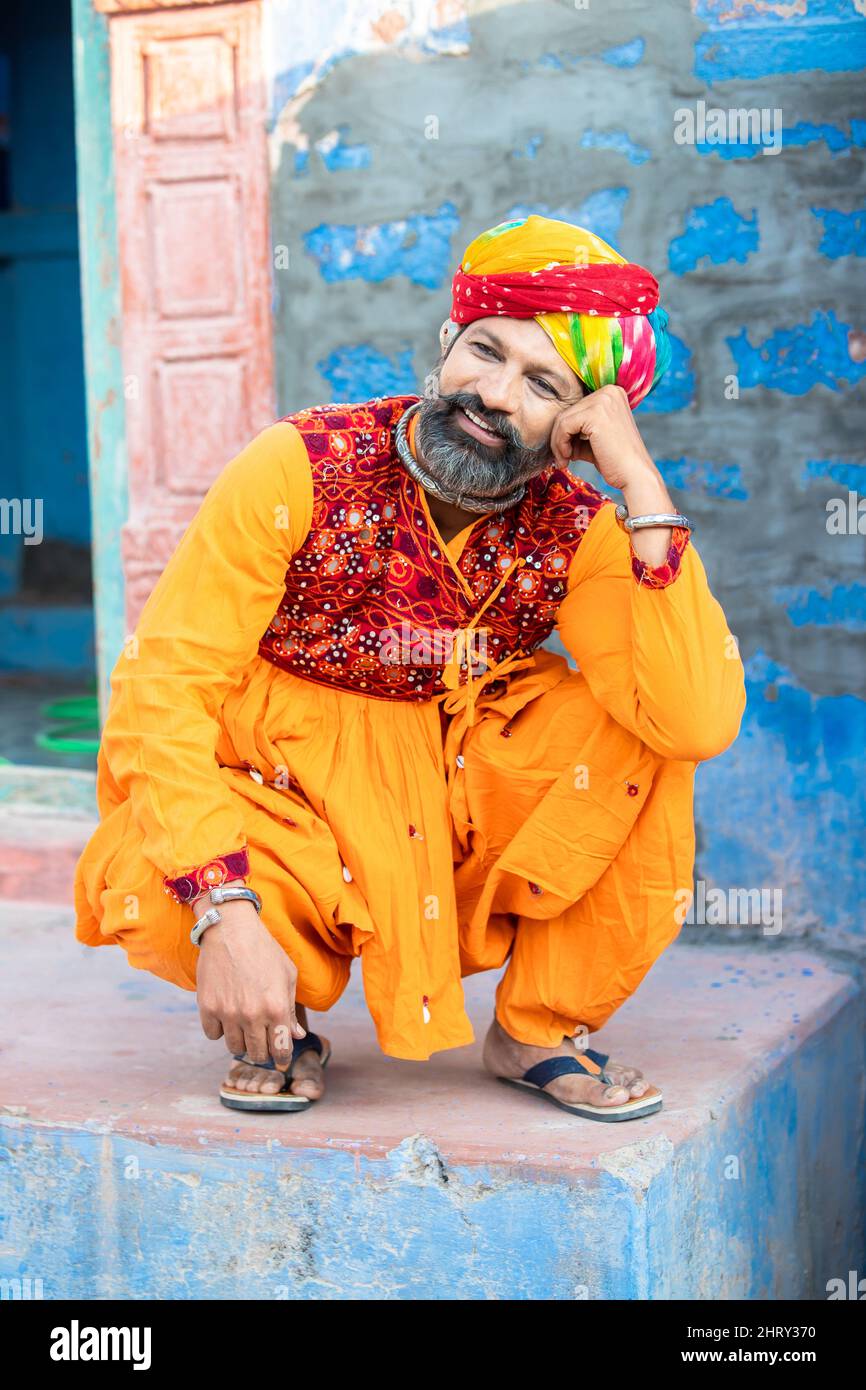 Portrait of happy traditional north indian man wearing colorful attire ...