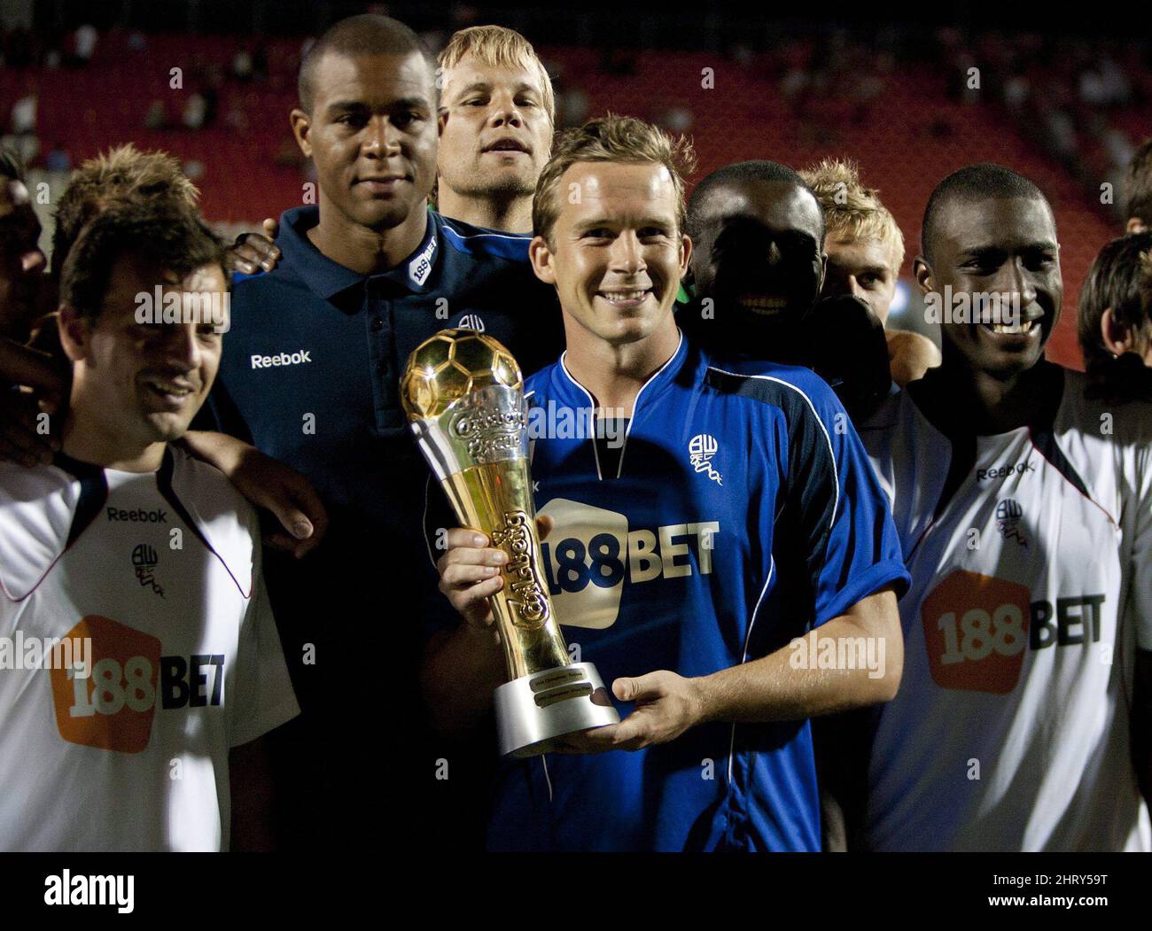 Bolton Wanderers captain Kevin Davies (centre) holds the Carlsberg Cup ...