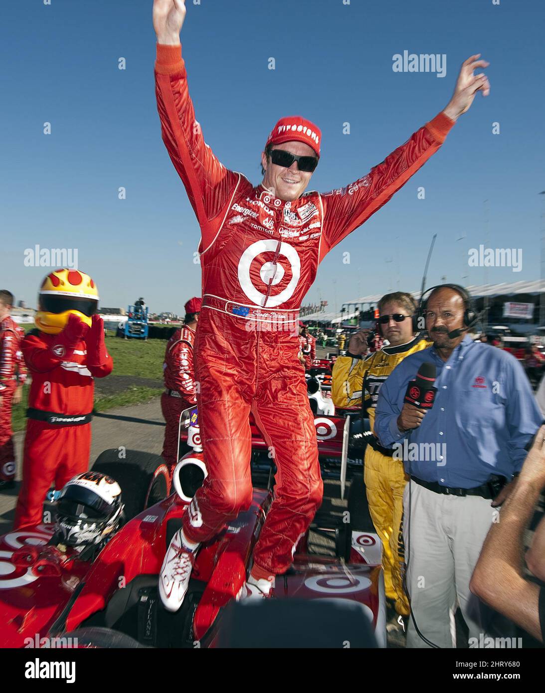 New Zealand's Scott Dixon leaps from his car as he celebrates winning ...