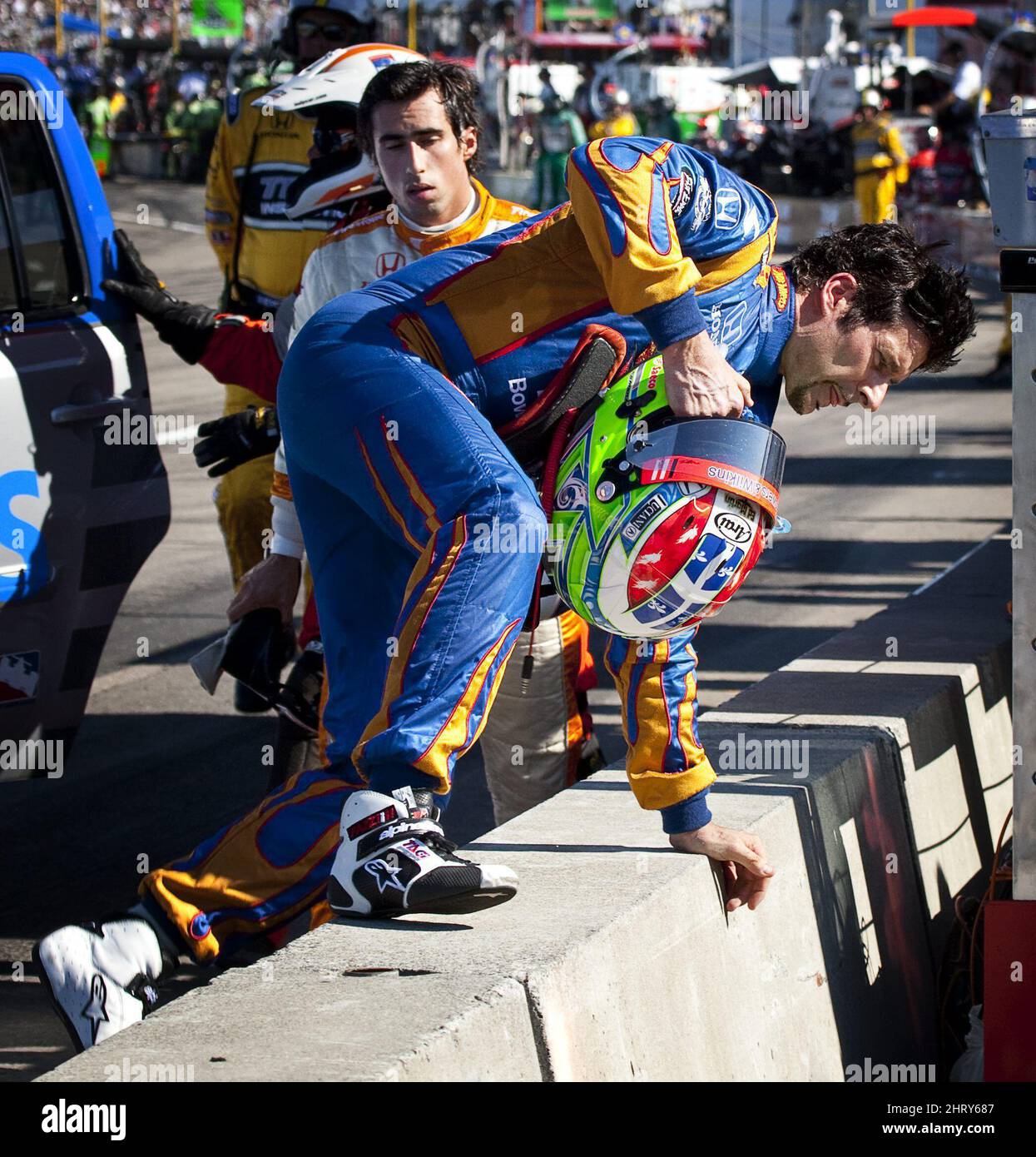 Alex Tagliani, from Lachenaie, Que., leaps over the pit wall following ...