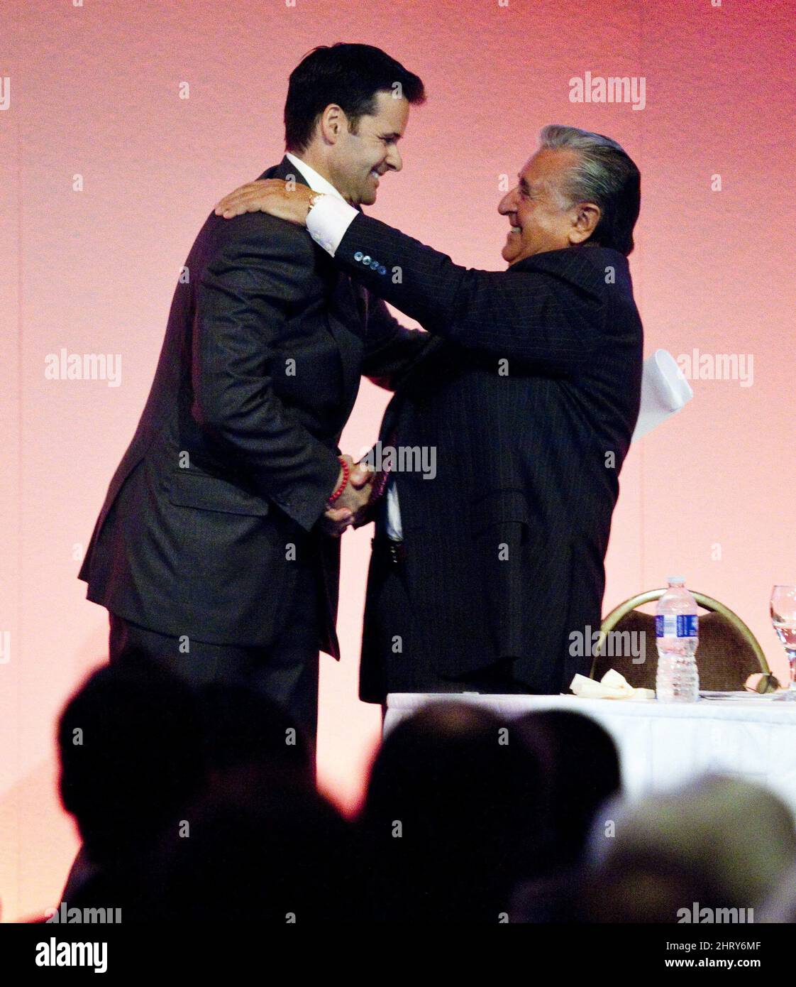 Saputo president and CEO Lino Saputo Jr., left, is hugged by his father ...