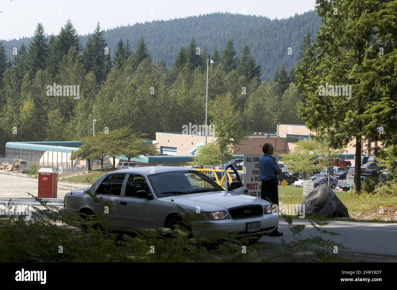 A corrections officer stands guard at the gate leading into the Fraser ...