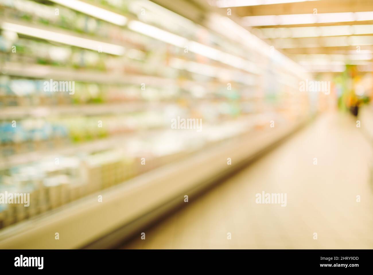Empty Supermarket Aisle and Shelves in blurry for background Stock ...
