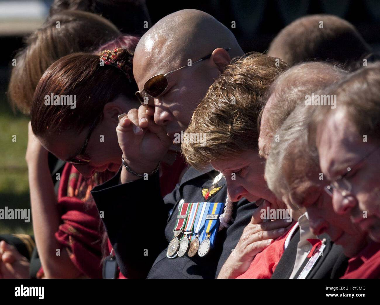 Late MCPL Andrew Miller's father Raymond Ealdama wipes tears from his ...