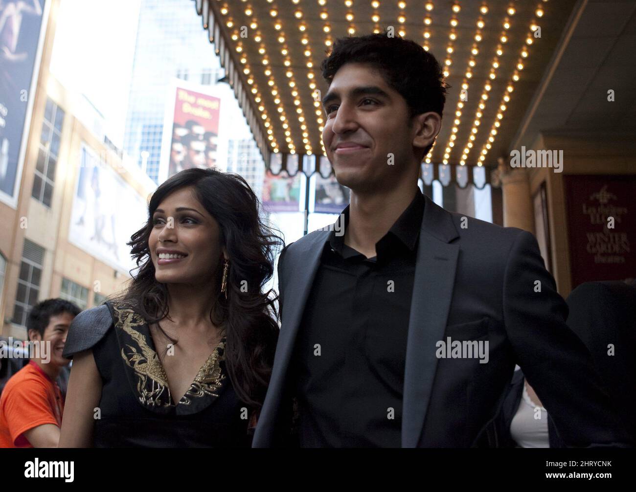 Freida Pinto (left) arrives at the gala screening of You Will Meet a ...