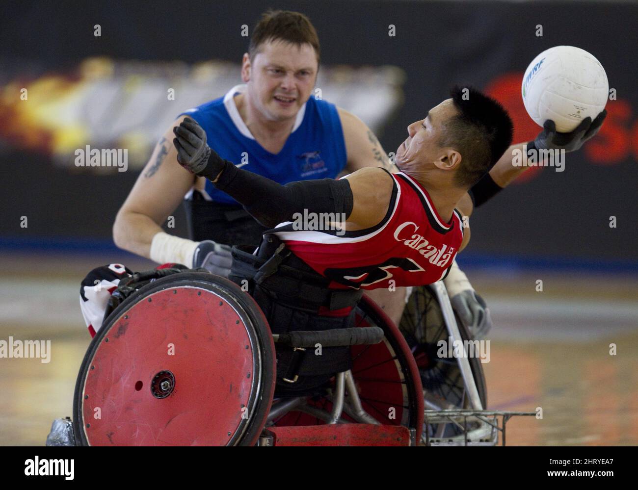 Team Canada's Ian Chan, right, tires to get the ball past Great Britain ...