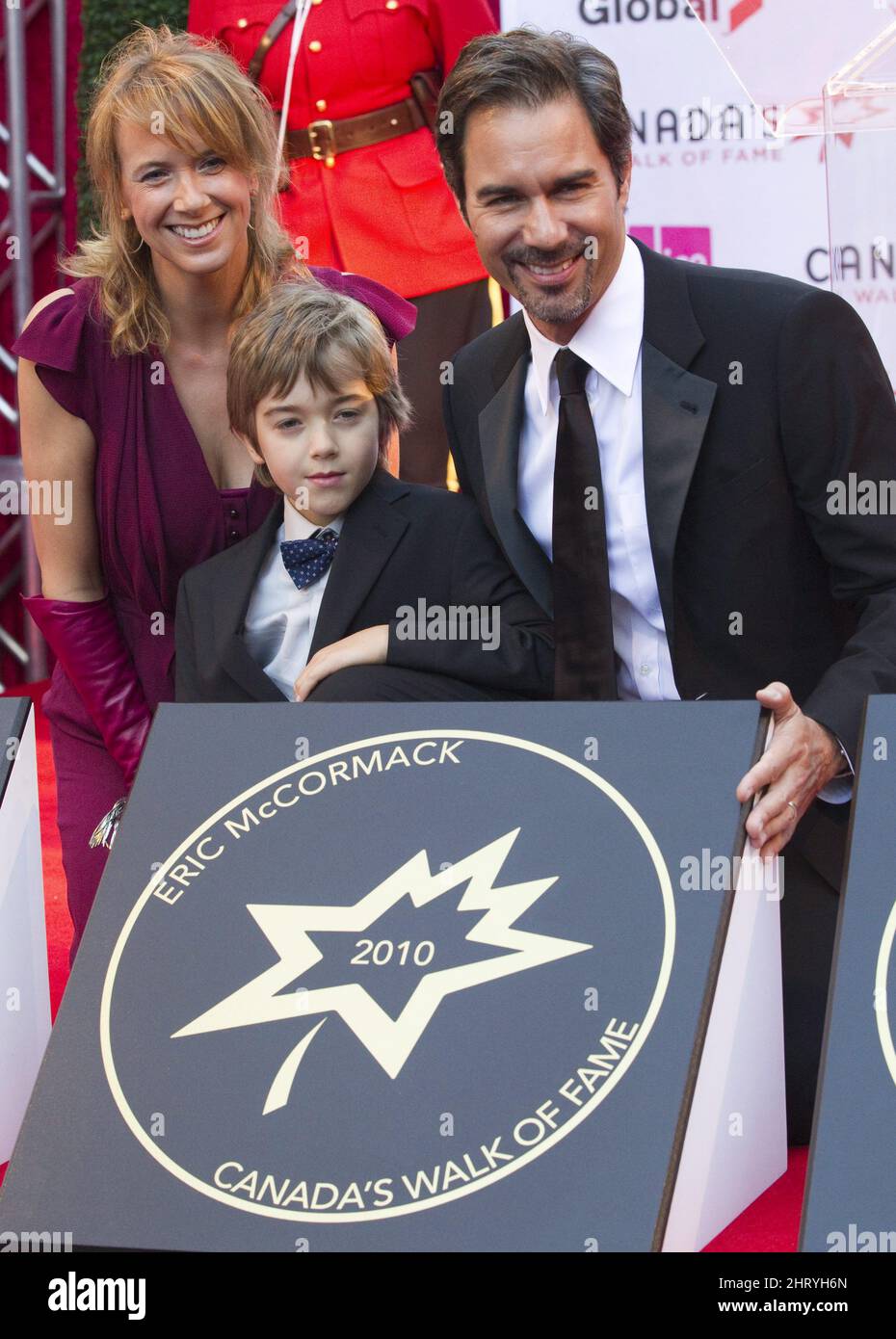 Actor Eric McCormack poses with his wife Janet and son Finnegan by his ...