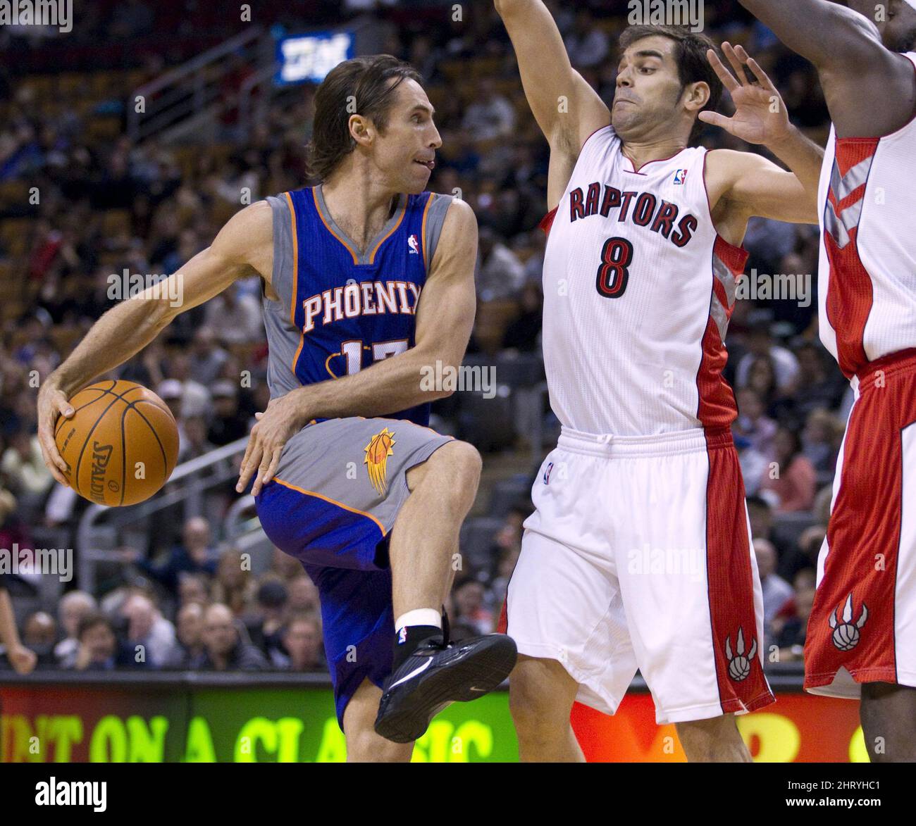 Phoenix Suns guard Steve Nash (left) makes a behind the back pass ...
