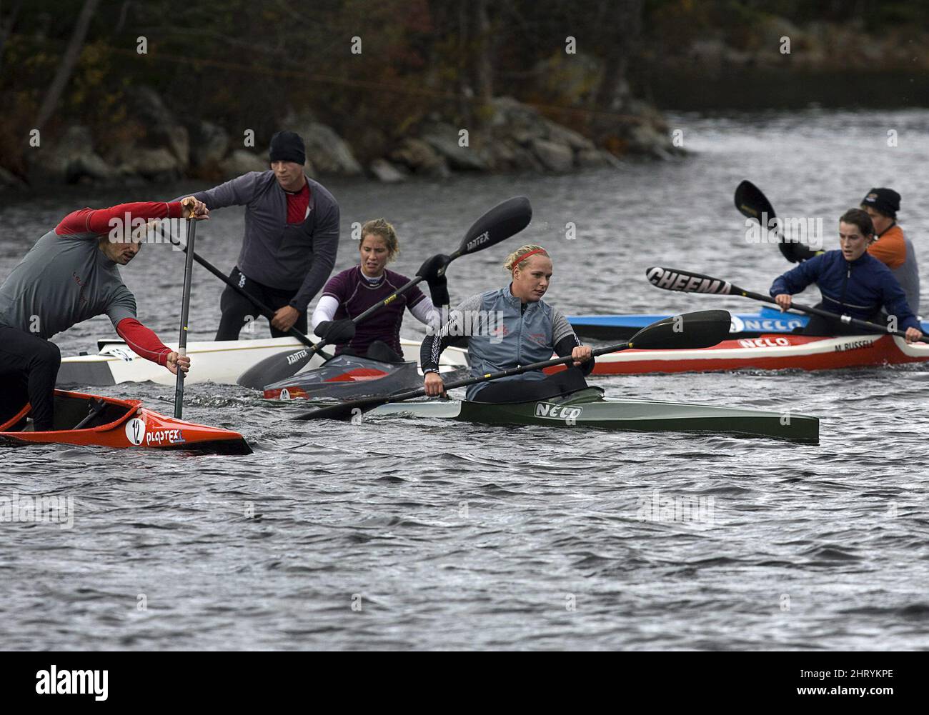 Sprint canoe and kayak paddlers round a buoy as they compete in the ...